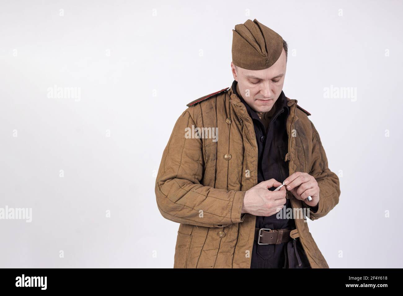 Portrait of a male actor in military uniform of an Russian tankman of ...