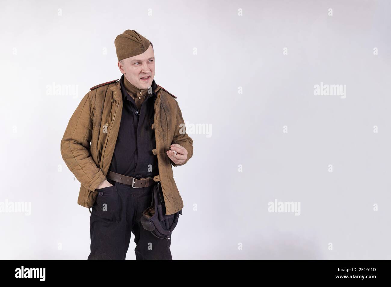 Portrait of a male actor in military uniform of an Russian tankman of ...