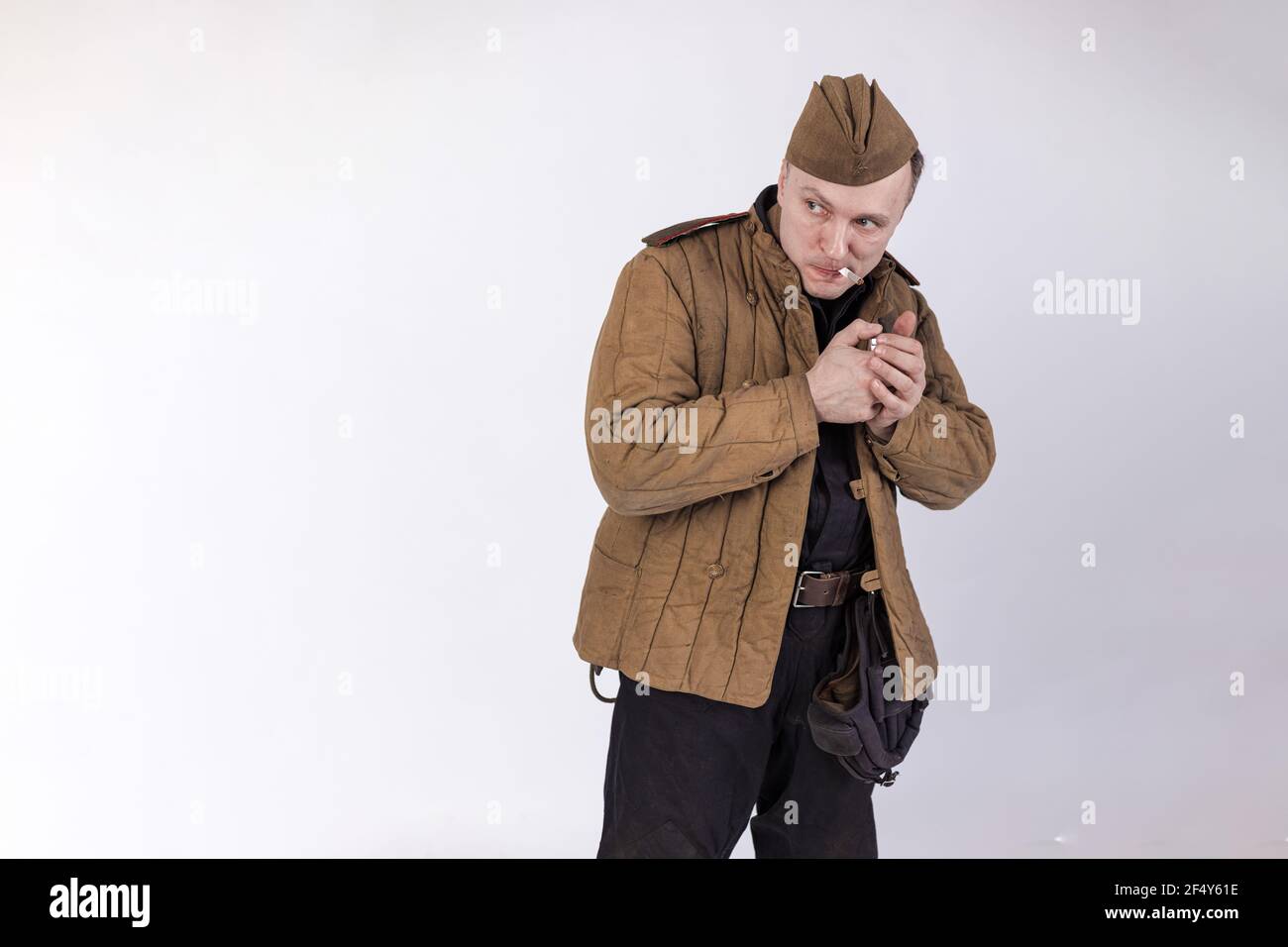 Portrait of a male actor in military uniform of an Russian tankman of ...