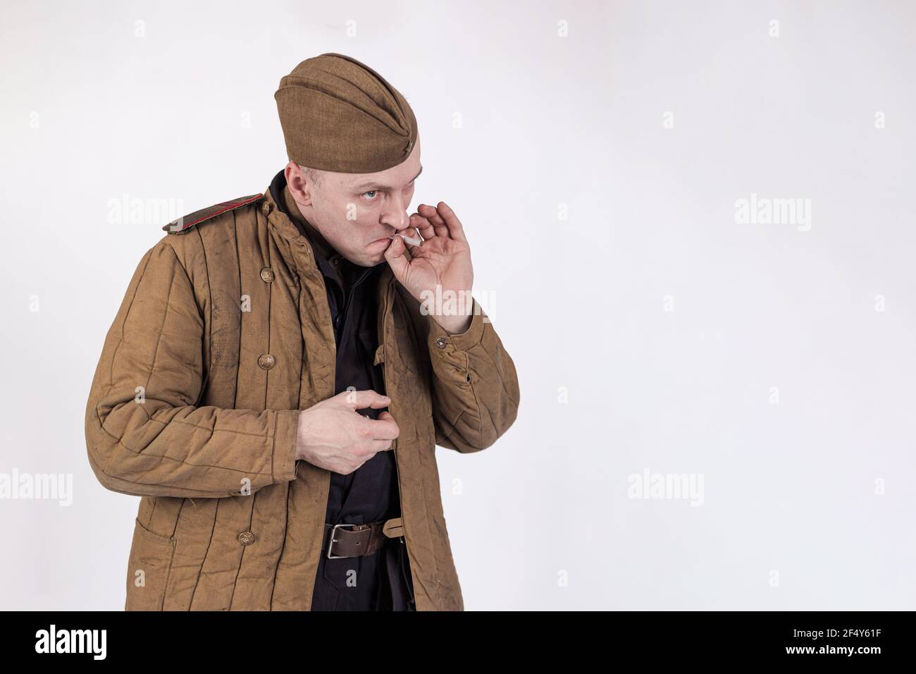 Portrait of a male actor in military uniform of an Russian tankman of ...