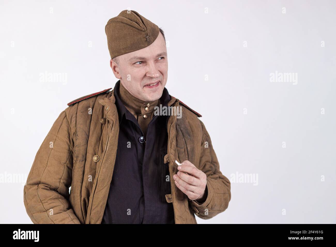 Portrait of a male actor in military uniform of an Russian tankman of ...