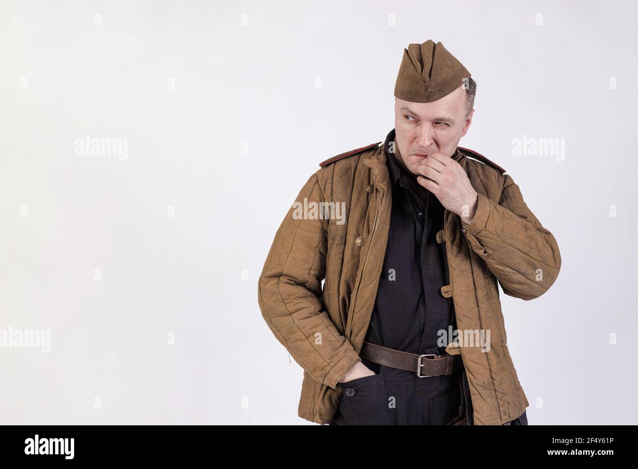 Portrait of a male actor in military uniform of an Russian tankman of ...