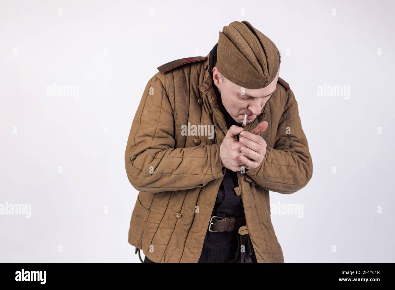Portrait of a male actor in military uniform of an Russian tankman of ...