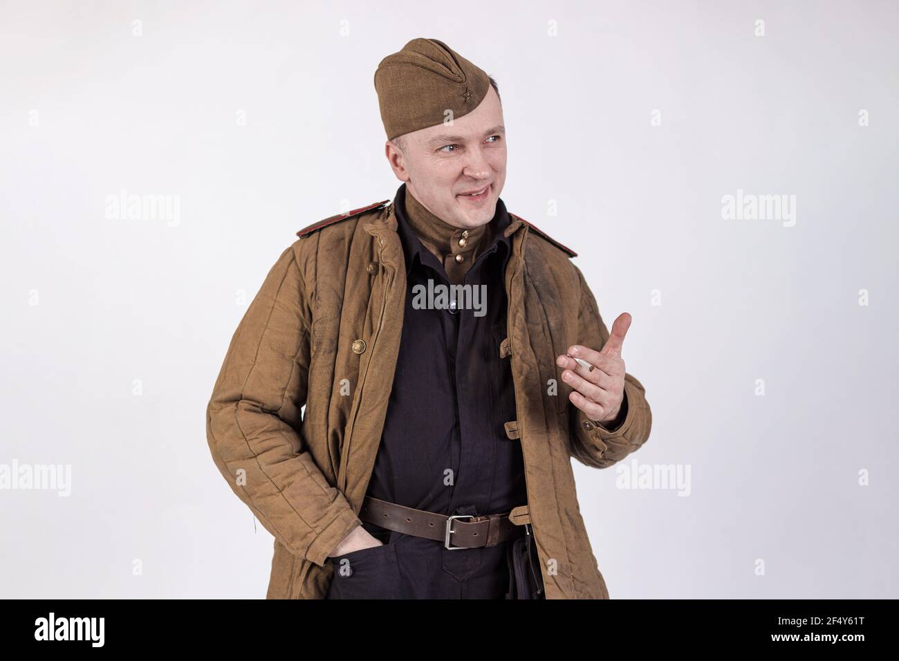 Portrait of a male actor in military uniform of an Russian tankman of ...