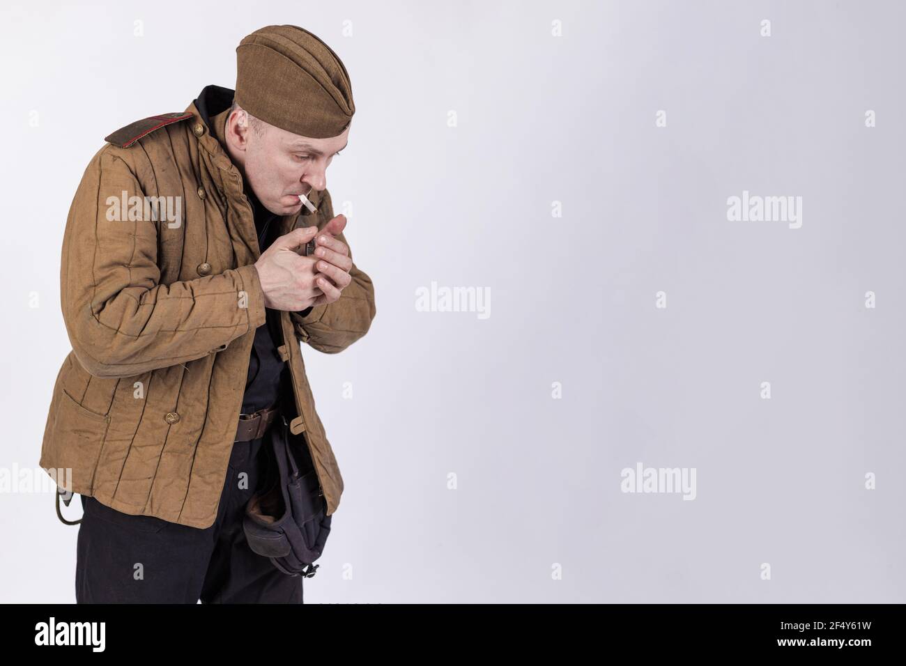 Portrait of a male actor in military uniform of an Russian tankman of ...