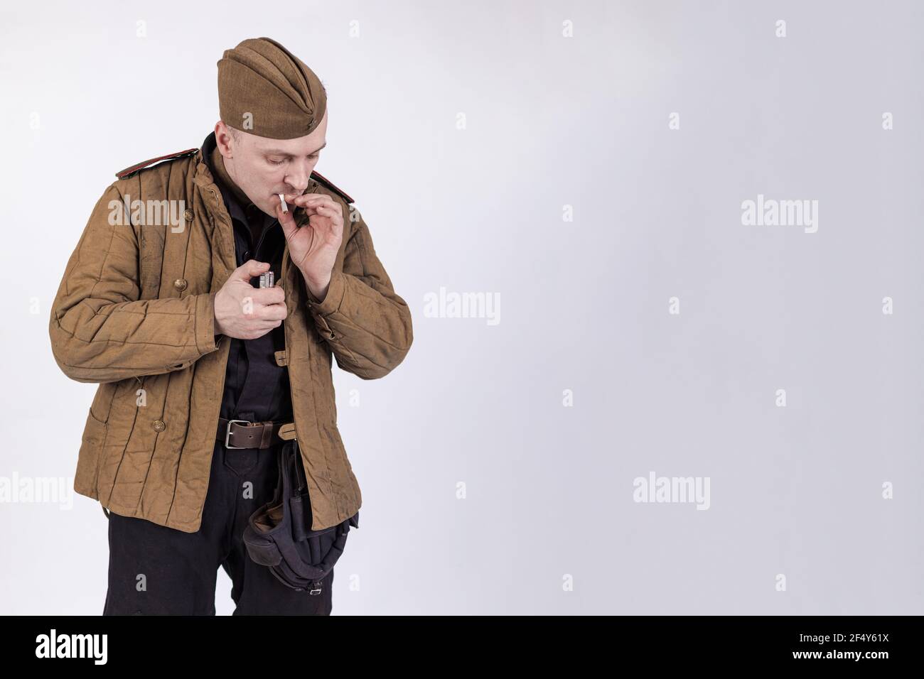 Portrait of a male actor in military uniform of an Russian tankman of ...