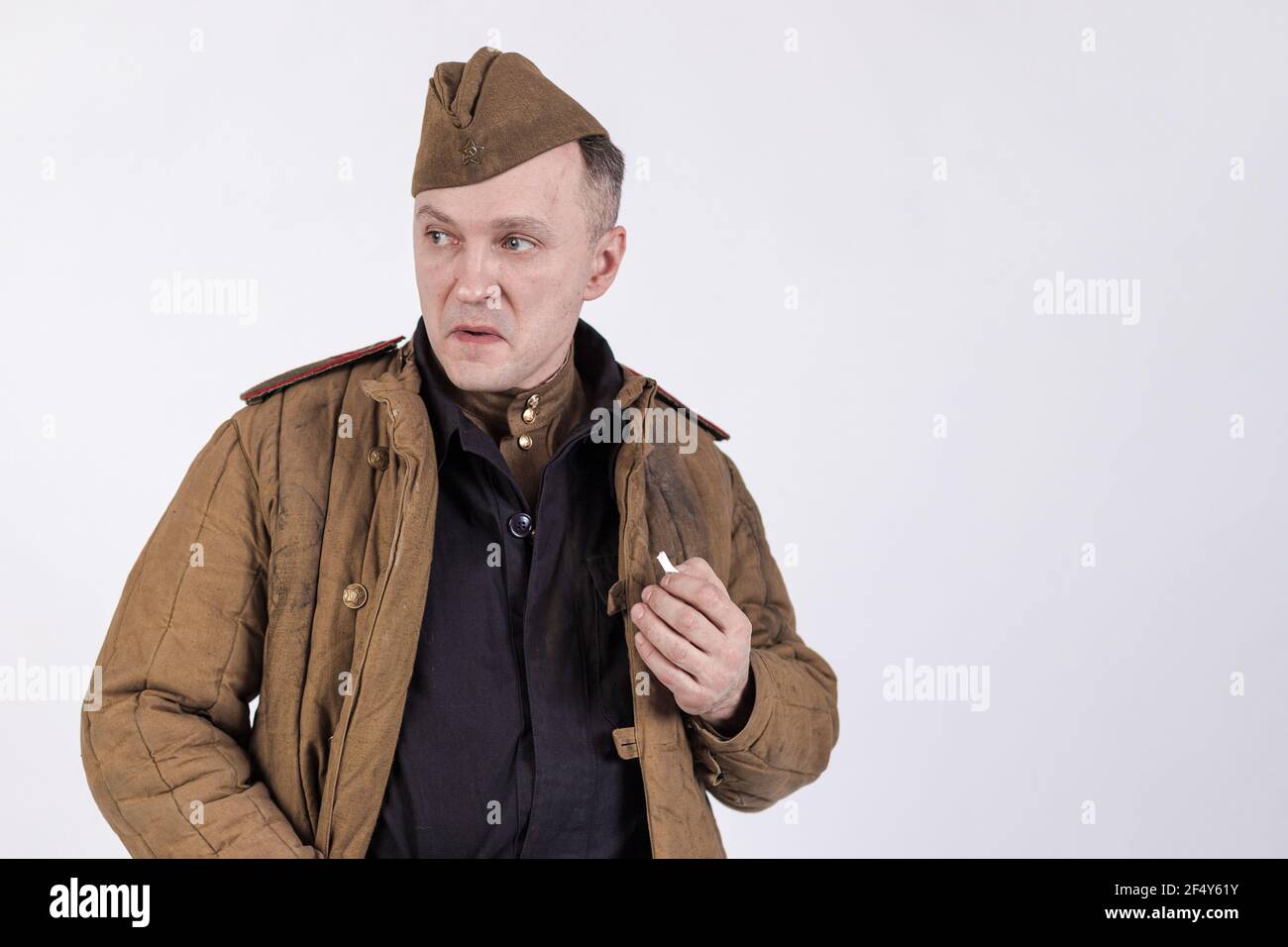 Portrait of a male actor in military uniform of an Russian tankman of ...