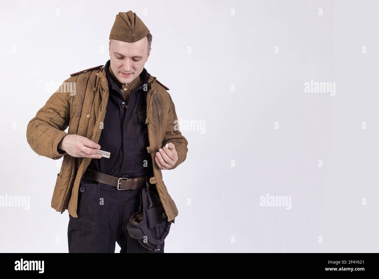 Portrait of a male actor in military uniform of an Russian tankman of ...