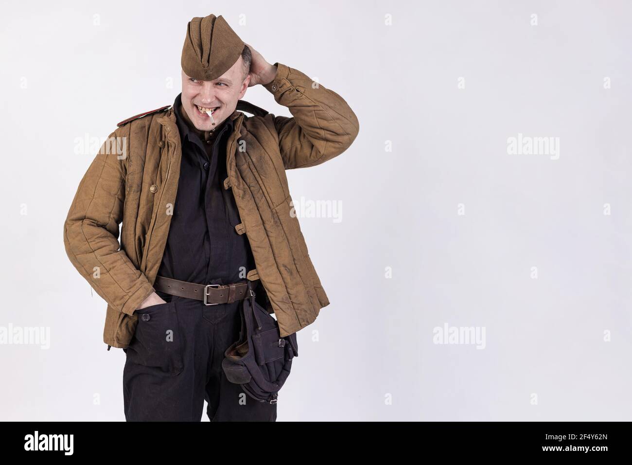 Portrait of a male actor in military uniform of an Russian tankman of ...