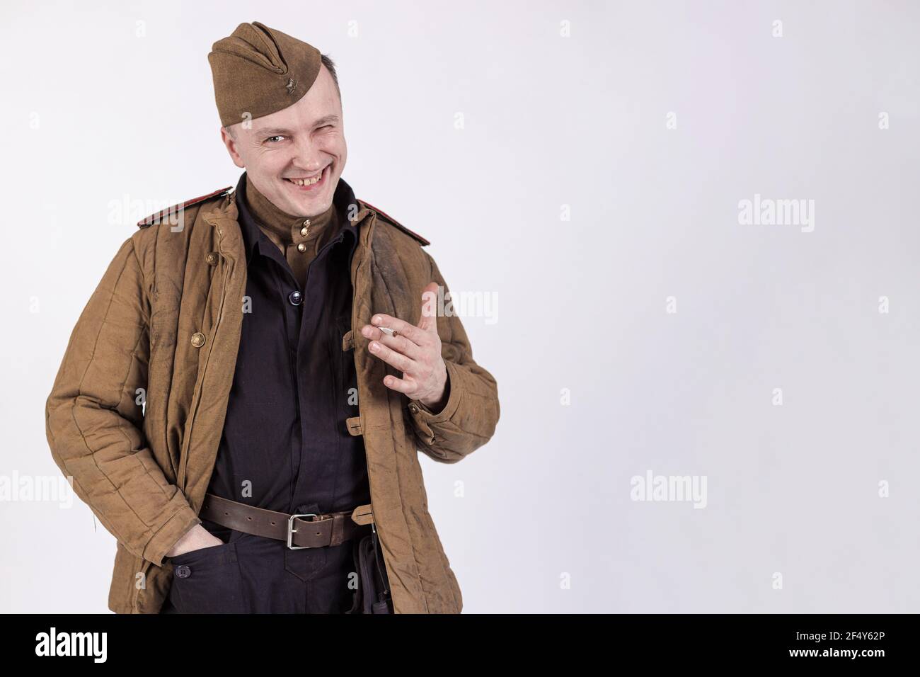 Portrait of a male actor in military uniform of an Russian tankman of ...