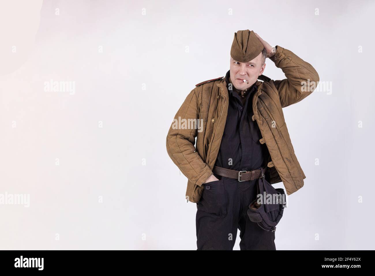 Portrait of a male actor in military uniform of an Russian tankman of ...