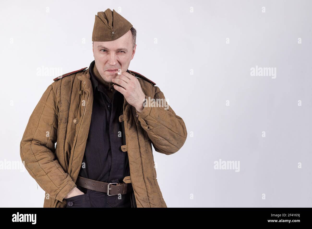 Portrait of a male actor in military uniform of an Russian tankman of ...