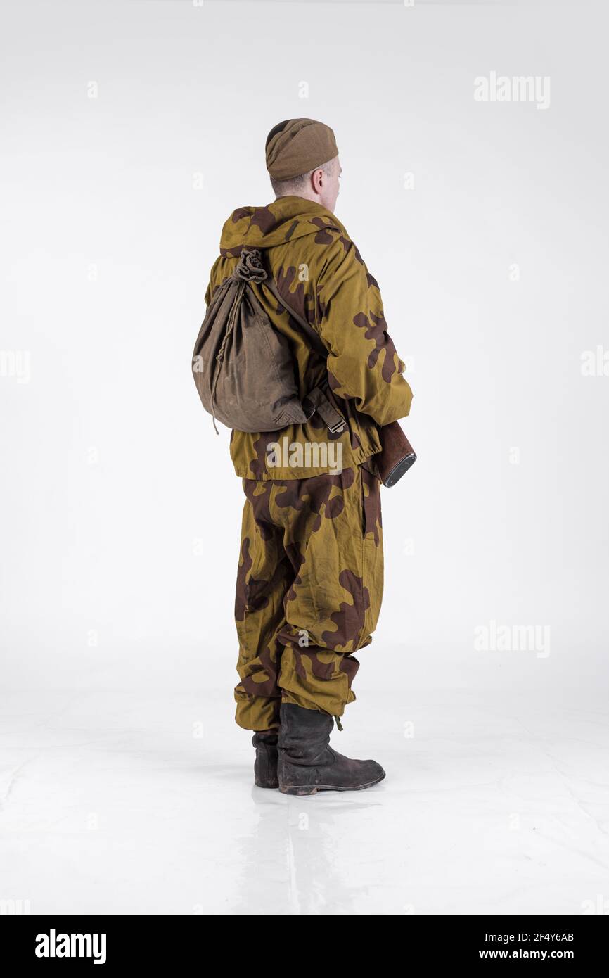 Actor man in an old military uniform and camouflage sniper marksman ...