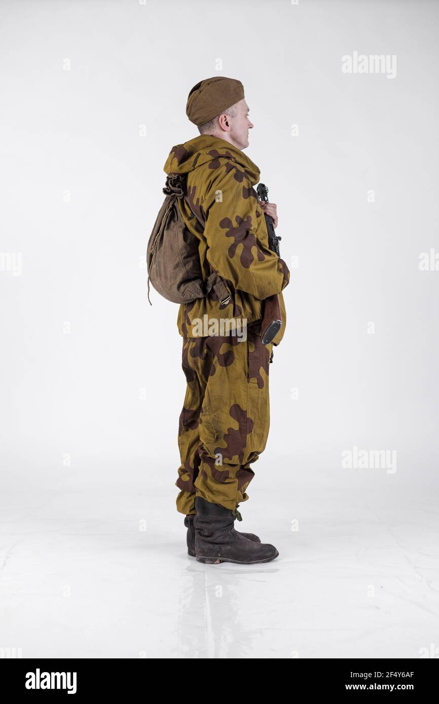 Actor man in an old military uniform and camouflage sniper marksman ...