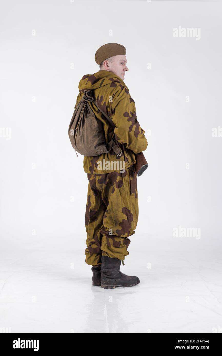 Actor man in an old military uniform and camouflage sniper marksman ...