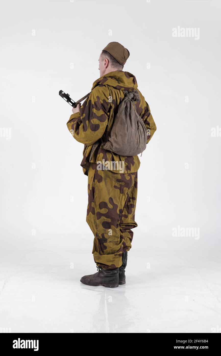 Actor man in an old military uniform and camouflage sniper marksman ...