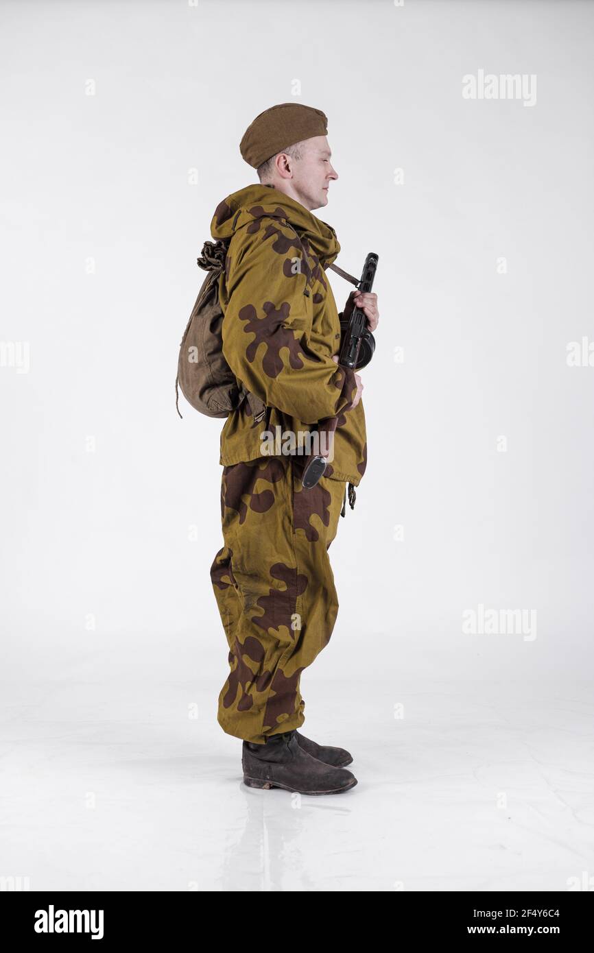 Actor man in an old military uniform and camouflage sniper marksman ...