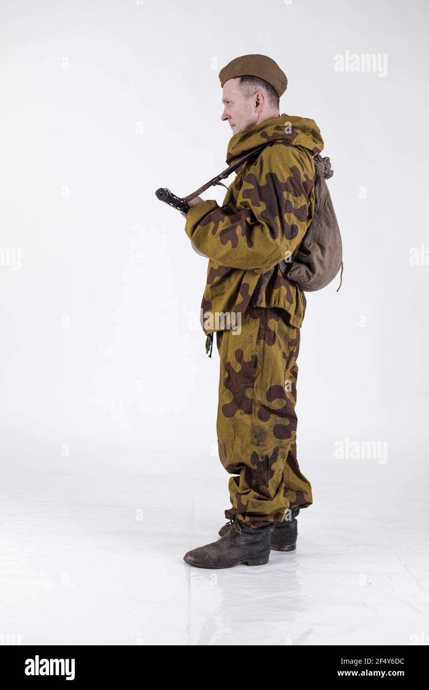 Actor man in an old military uniform and camouflage sniper marksman ...