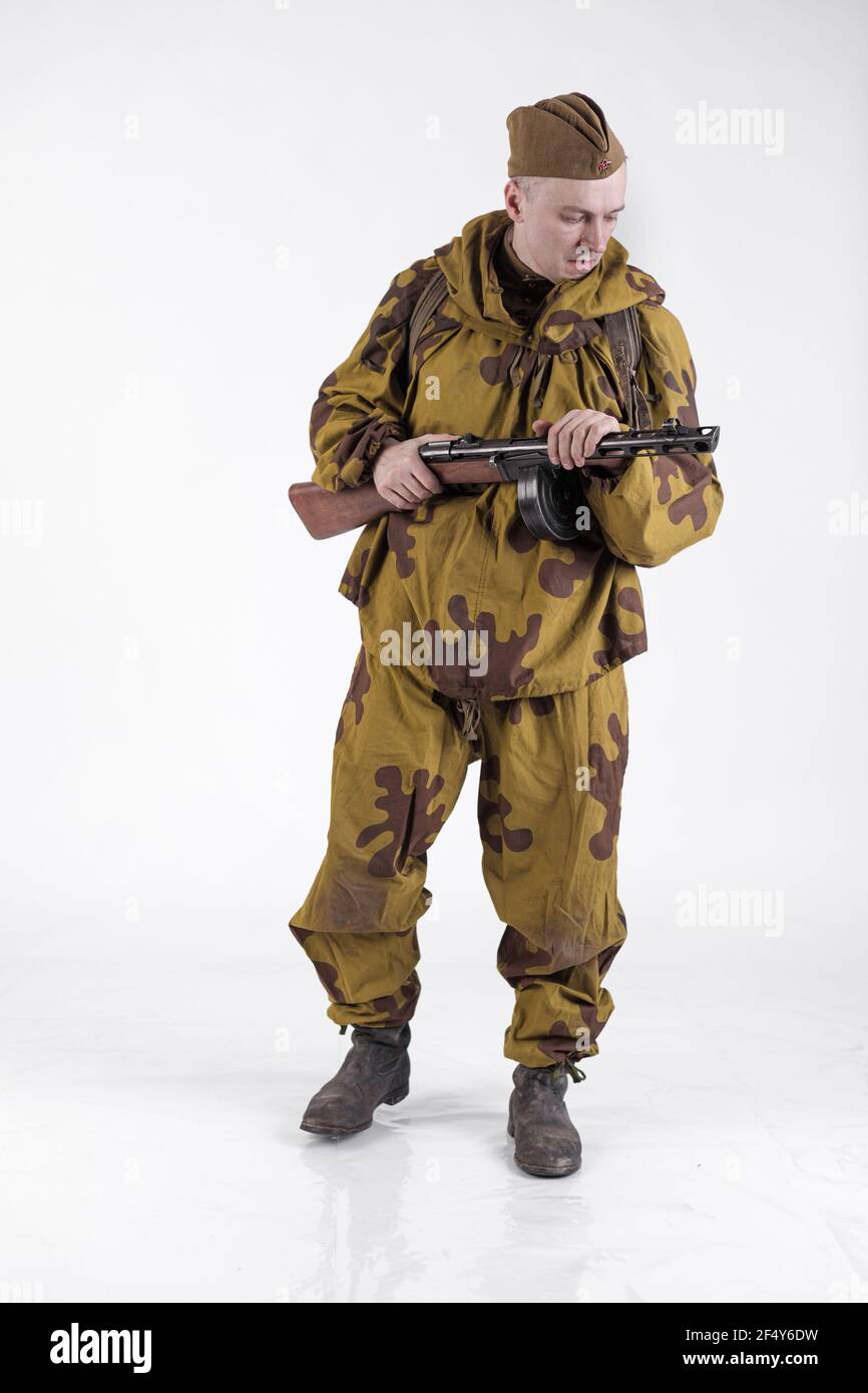 Actor man in an old military uniform and camouflage sniper marksman ...