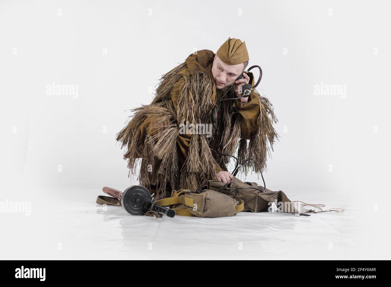 Man soldier radio operator of the Soviet army in old military uniform ...