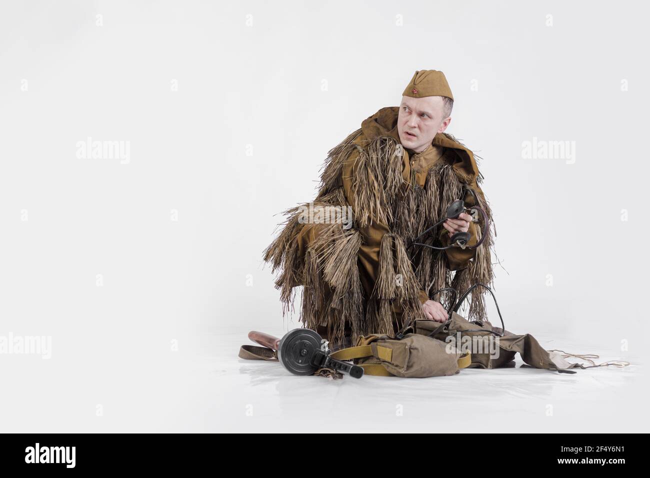 Man soldier radio operator of the Soviet army in old military uniform ...