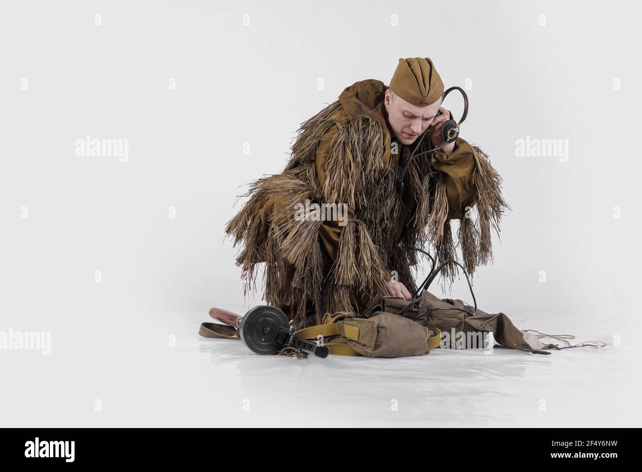 Man soldier radio operator of the Soviet army in old military uniform ...