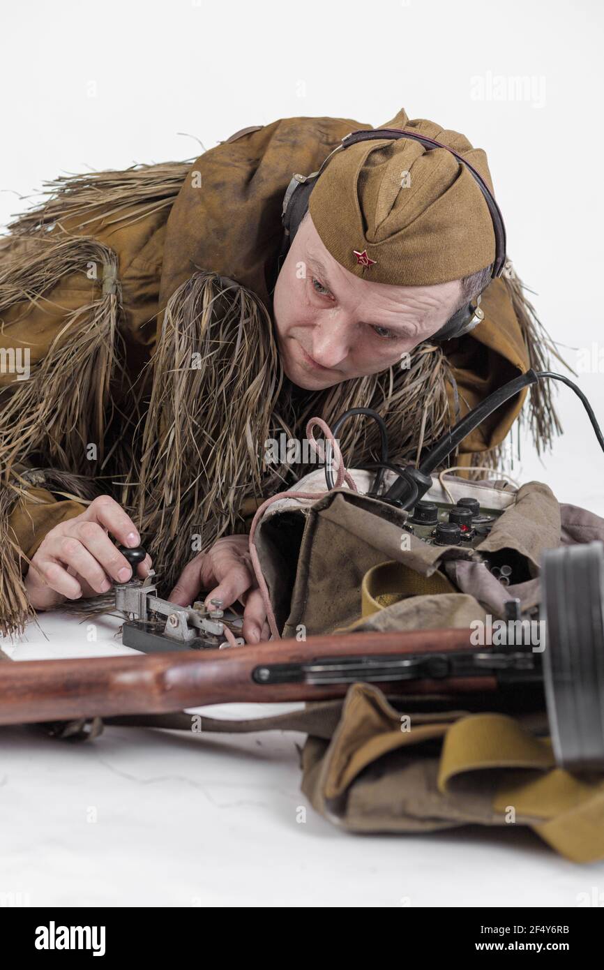 Man soldier radio operator of the Soviet army in old military uniform ...