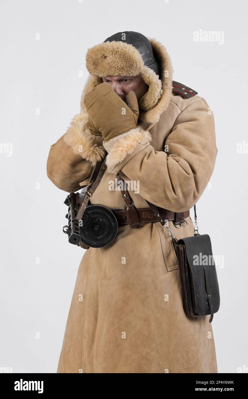 A man in a winter military uniform of an officer of the Soviet army ...