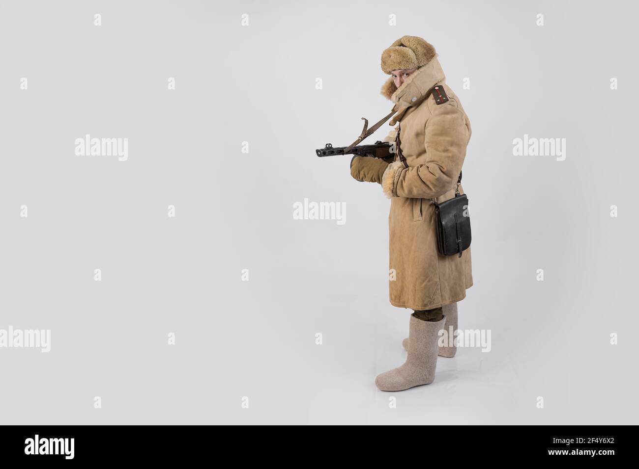 A man in a winter military uniform of an officer of the Soviet army ...