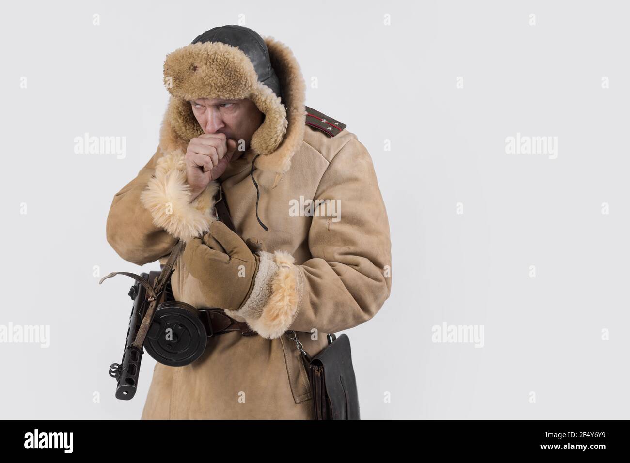A man in a winter military uniform of an officer of the Soviet army ...