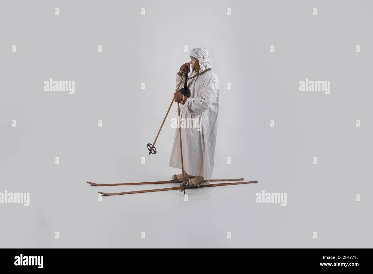 A man in a winter military uniform white camouflage, a soldier of the ...