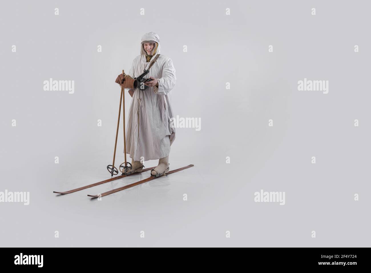 A man in a winter military uniform white camouflage, a soldier of the ...