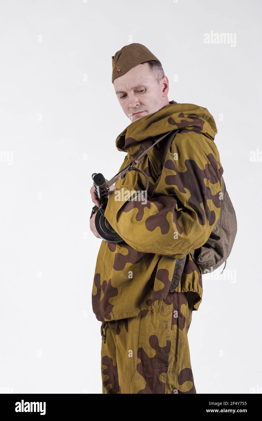 Actor man in an old military uniform and camouflage sniper marksman ...