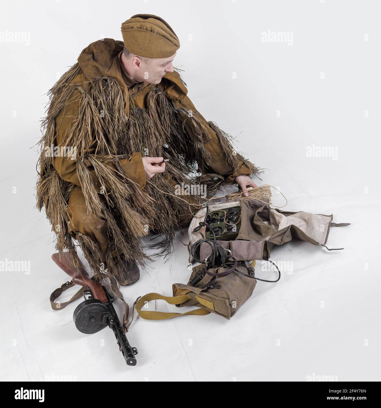 Man soldier radio operator of the Soviet army in old military uniform ...