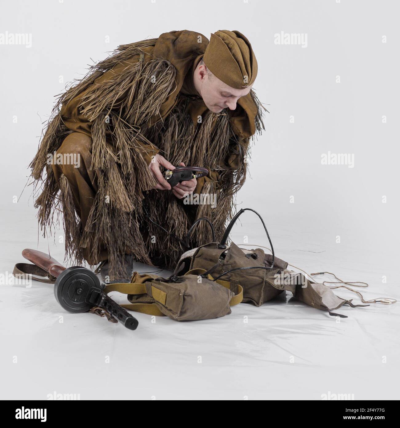 Man soldier radio operator of the Soviet army in old military uniform ...