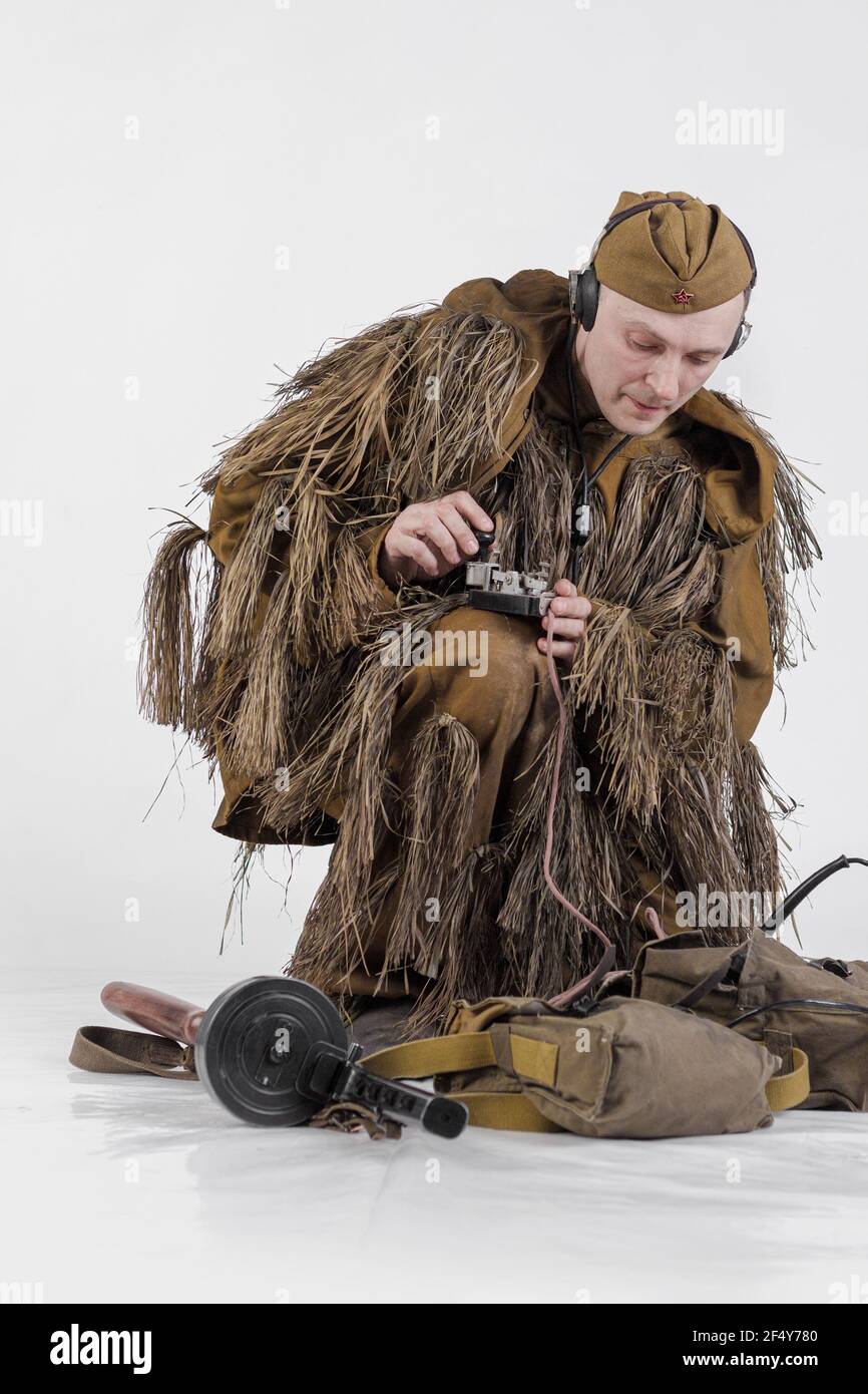 Man soldier radio operator of the Soviet army in old military uniform ...