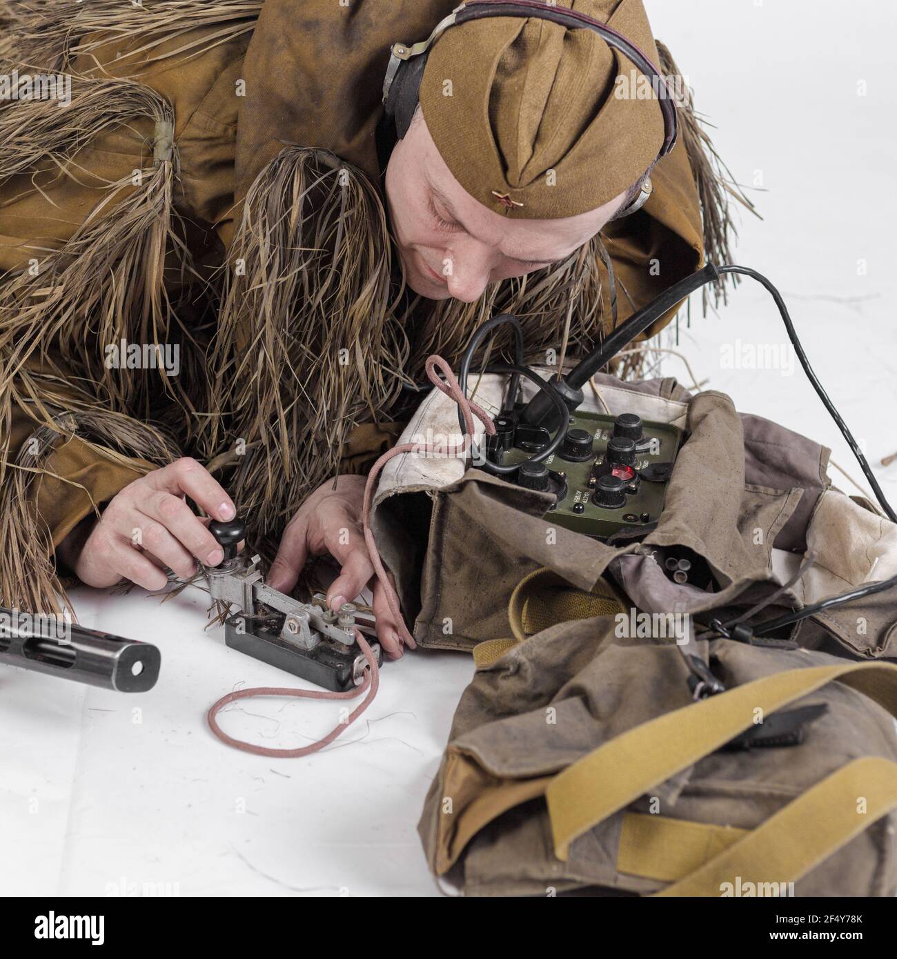 Man soldier radio operator of the Soviet army in old military uniform ...