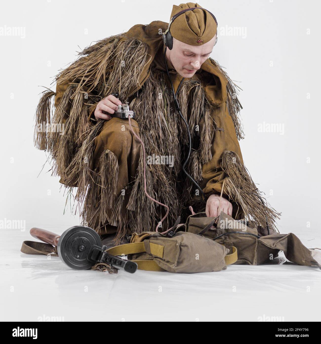 Man soldier radio operator of the Soviet army in old military uniform ...