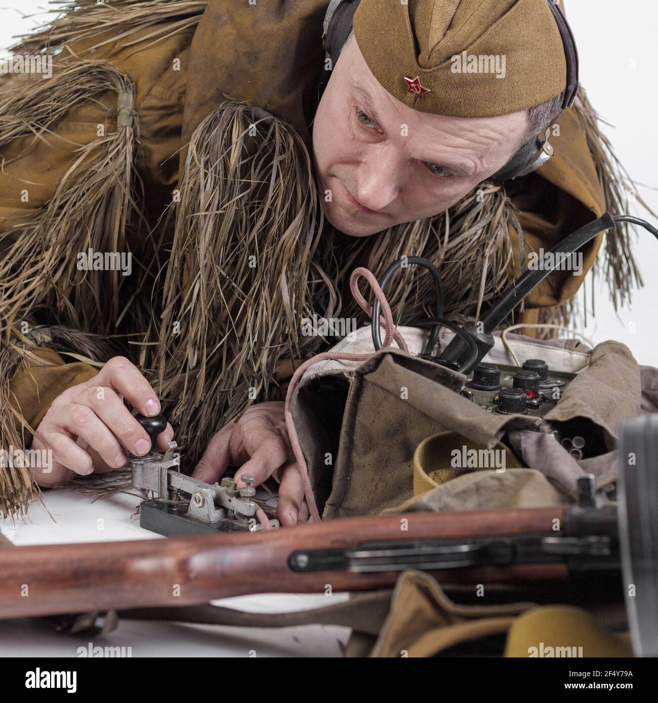Man soldier radio operator of the Soviet army in old military uniform ...