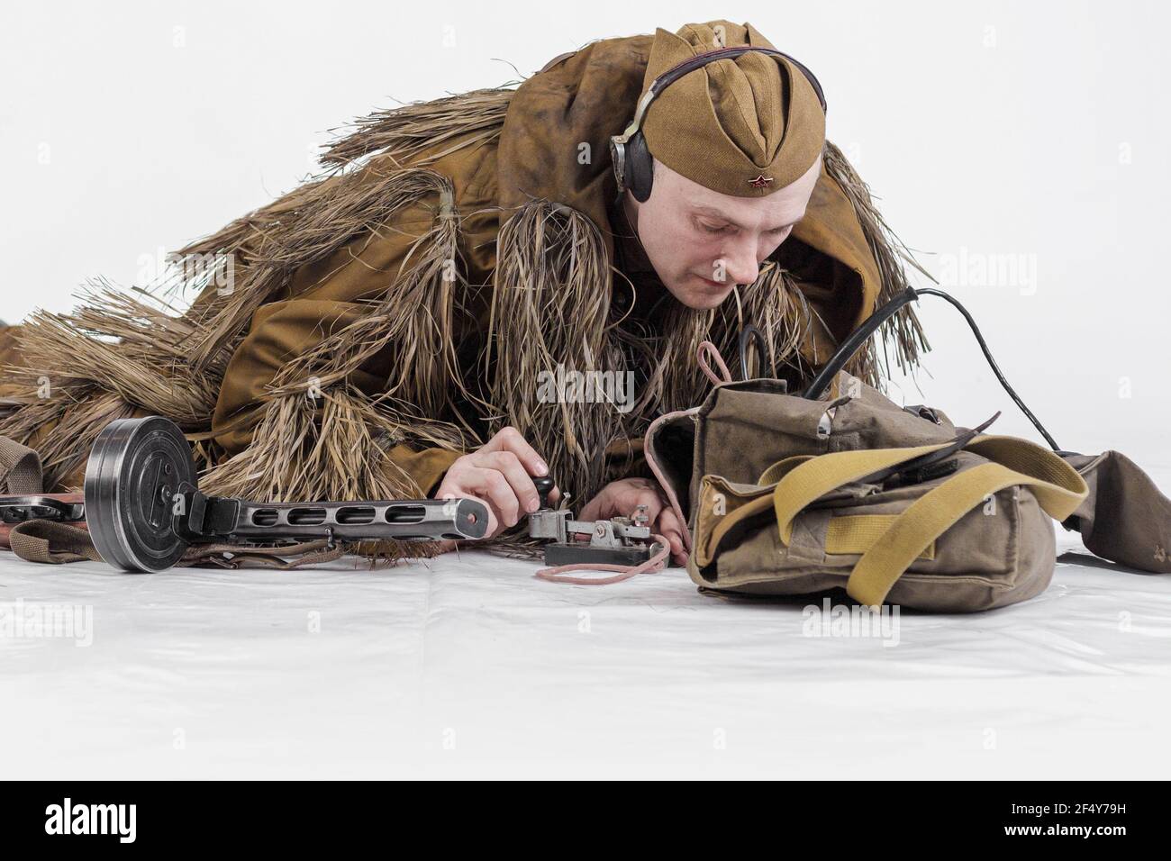 Man soldier radio operator of the Soviet army in old military uniform ...