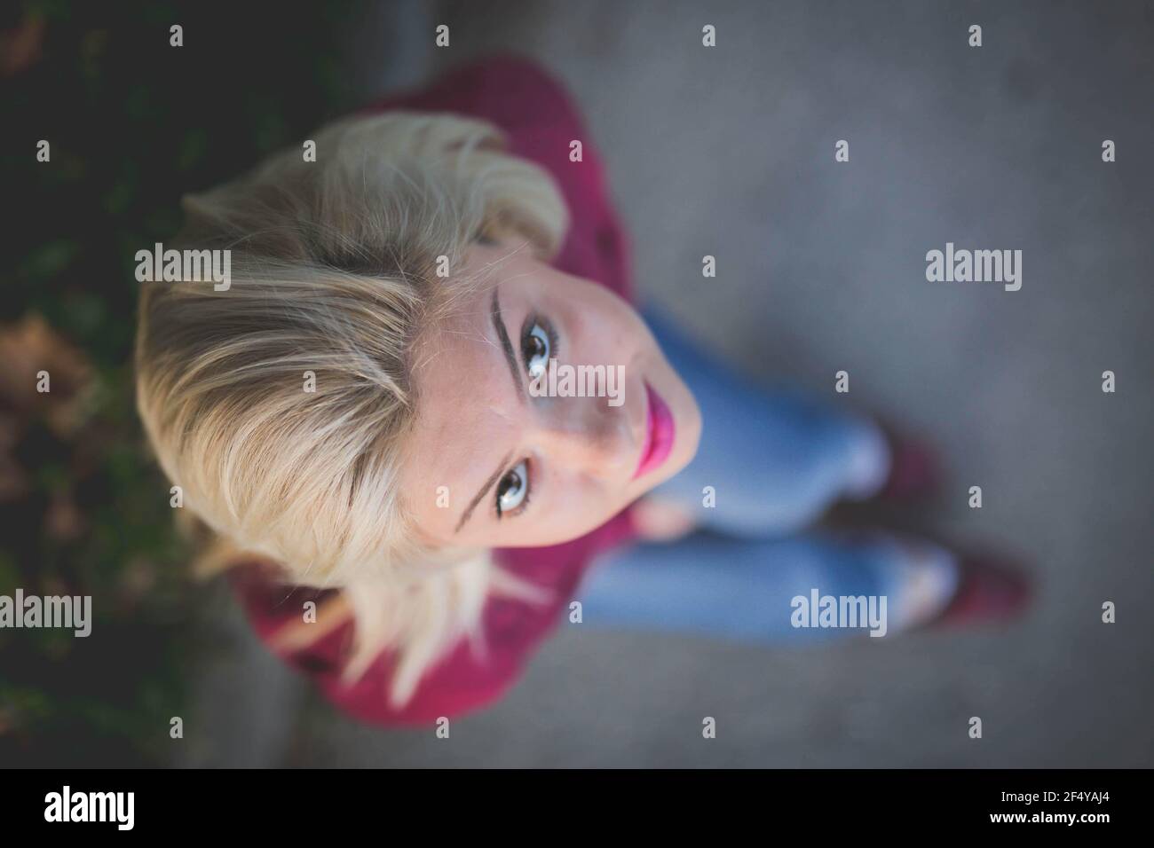 Top view of a young attractive female looking up Stock Photo - Alamy