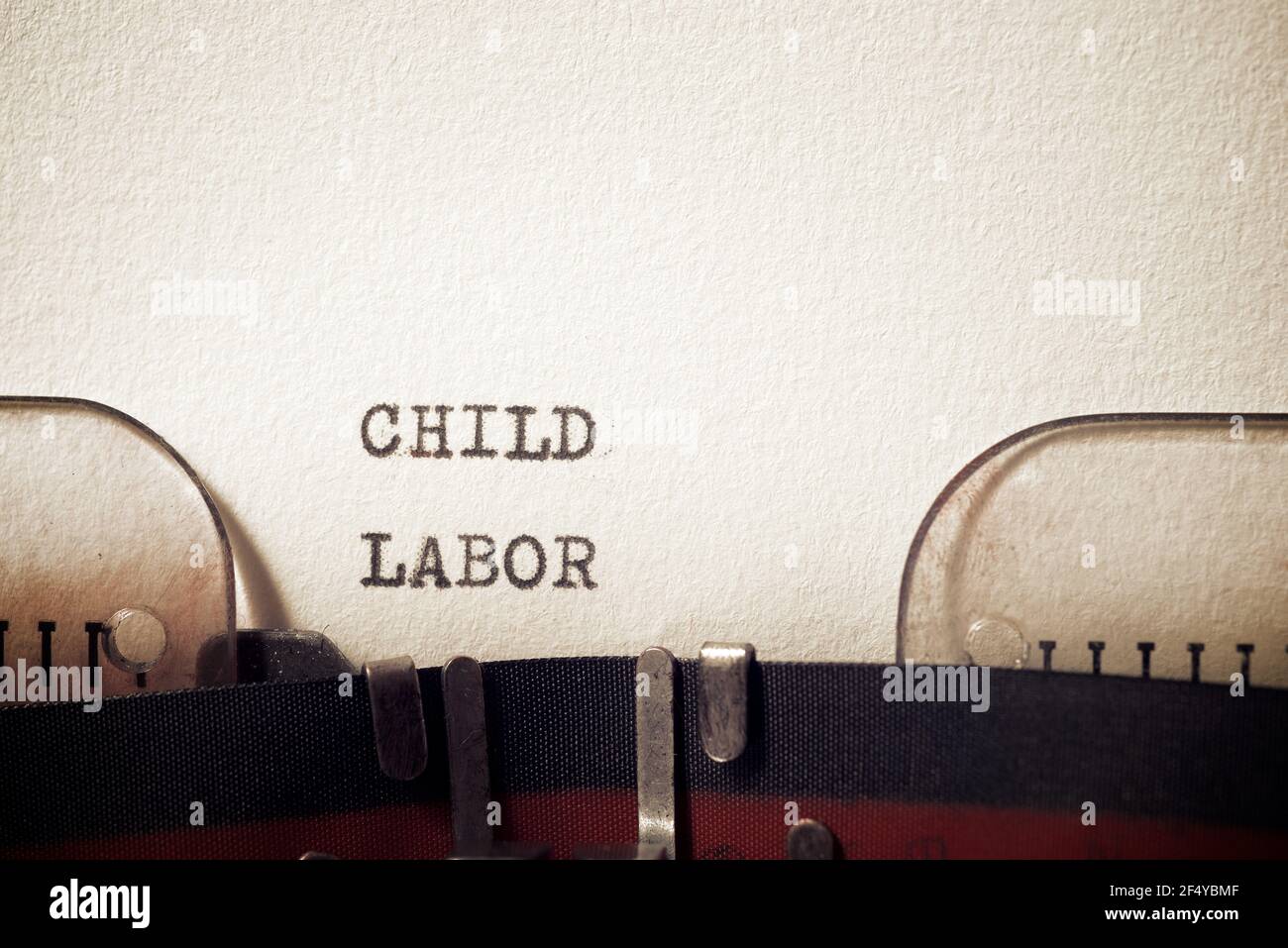 Child labor phrase written with a typewriter Stock Photo - Alamy