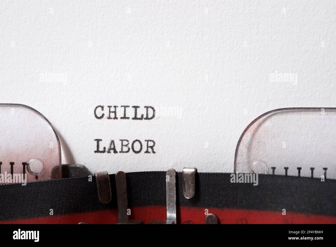 Child labor phrase written with a typewriter Stock Photo - Alamy