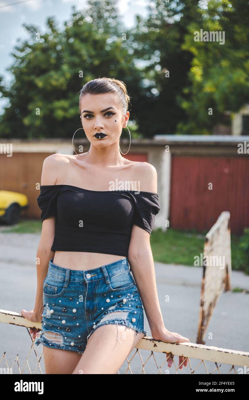 Attractive Bosnian Caucasian woman wearing a black shirt looking at the ...