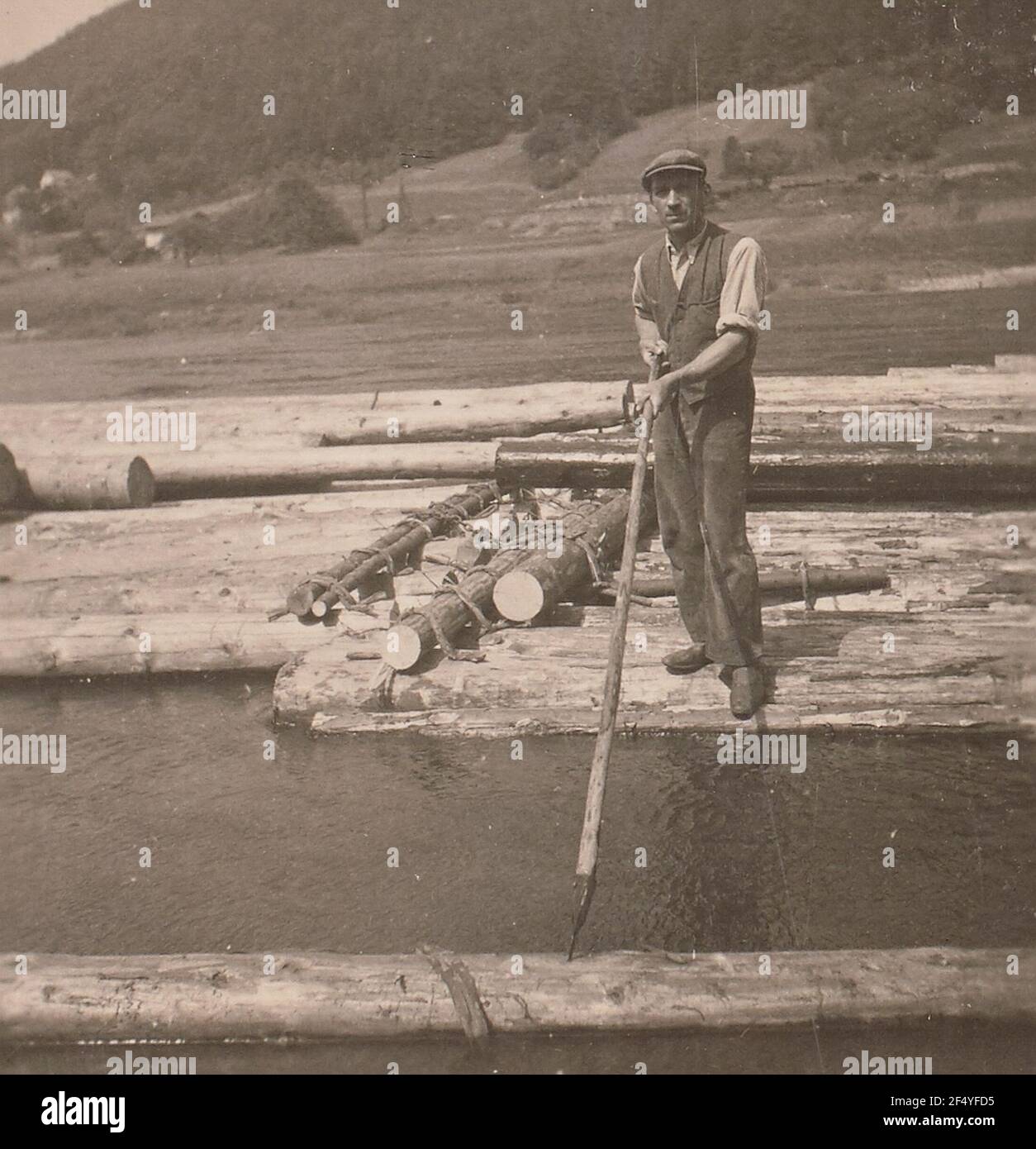 Shore of the Elbe with raft construction. Rafter leads with the raft ...