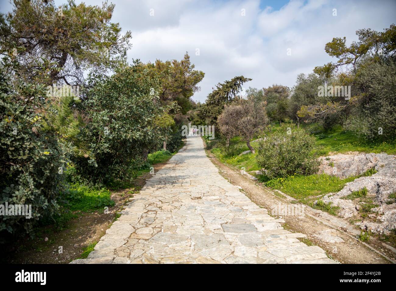 Filopappou hill, Athens, Greece. Paved path under ancient Greek ...