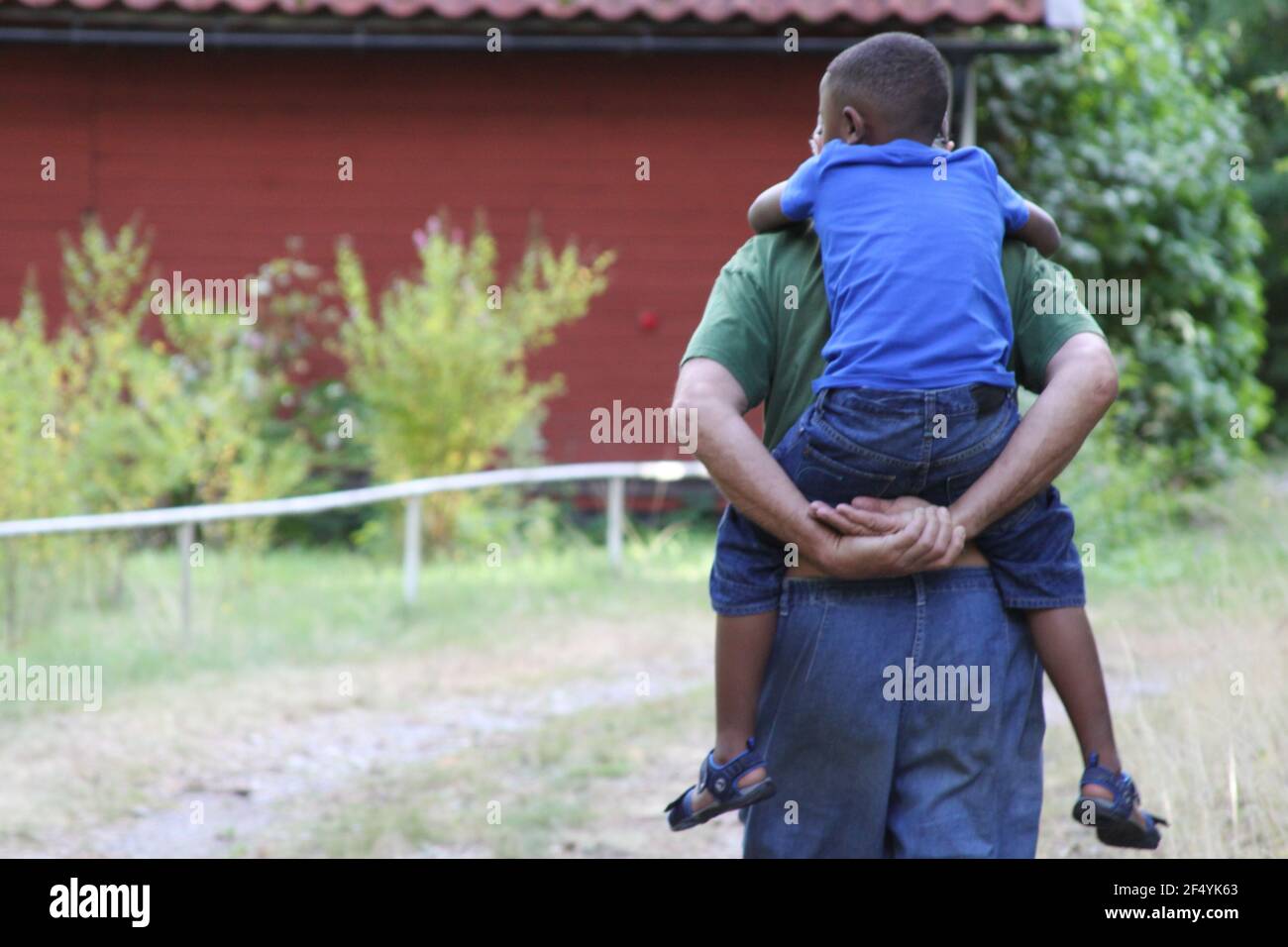 A piggyback given by grandpa in the country house in stockholm, sweden ...