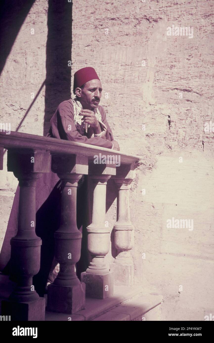 Travel photos Egypt. Cairo. Egyptian with FES, looking over a parapet ...