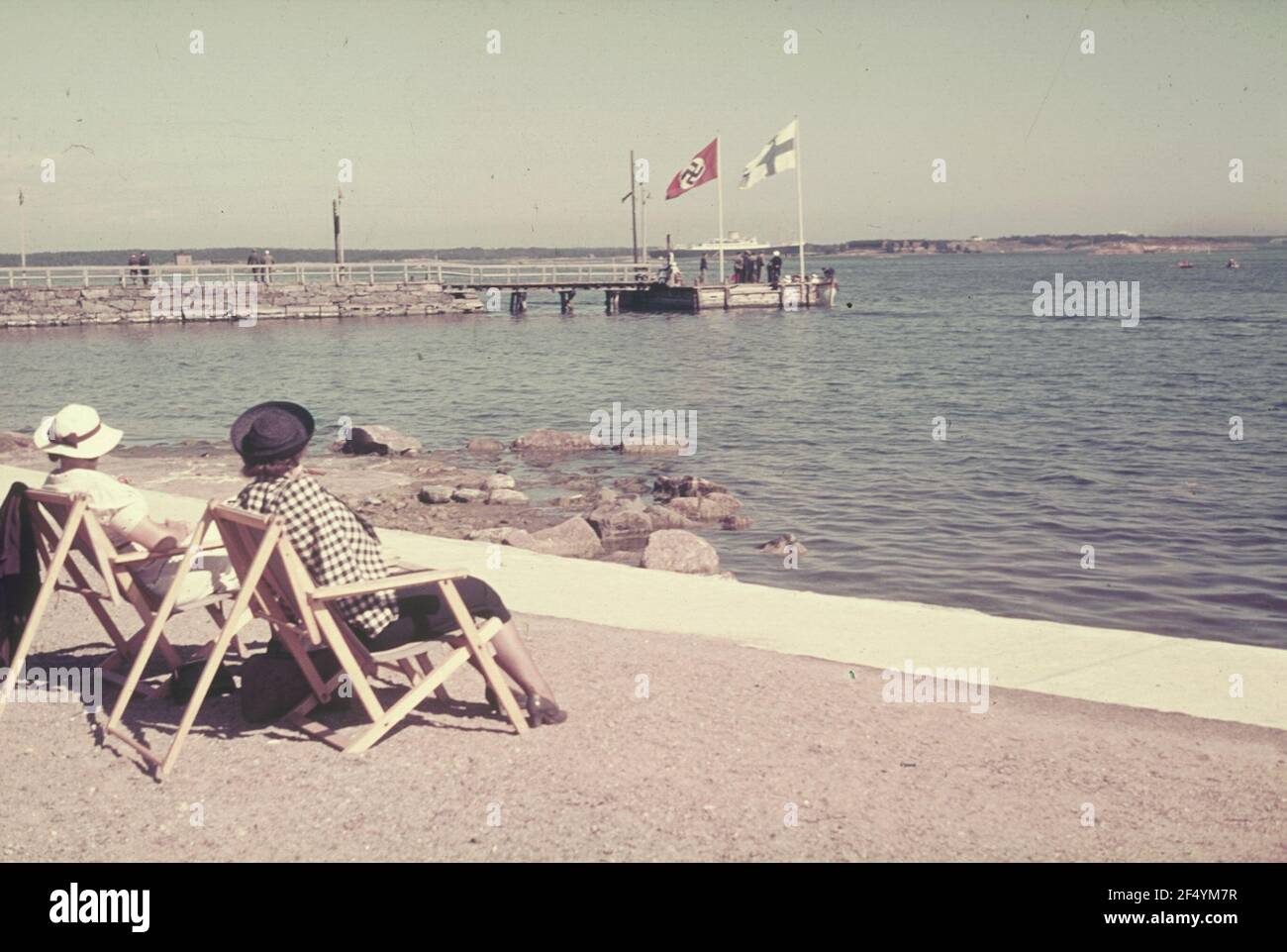 Travel photos Finland. Tourists in sun loungers in front of a beach ...