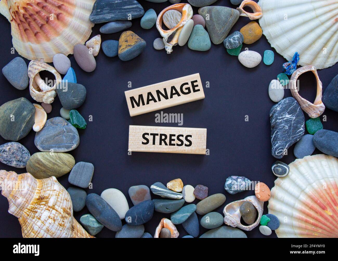 Manage stress and be health symbol. Wooden blocks with words 'manage ...